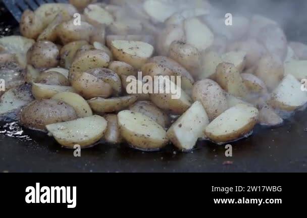 closeup homemade fried potato. Cooking fried potatoes in outdoor ...