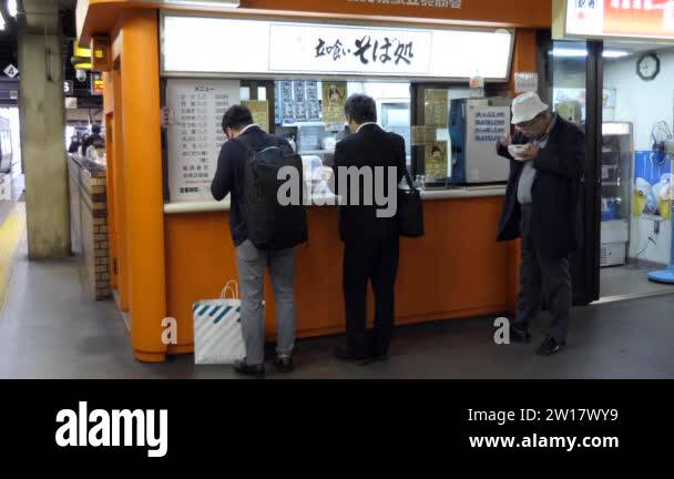 SAPPORO / JAPAN - JULY 2019: Japanese commuters eating noodle soup for ...