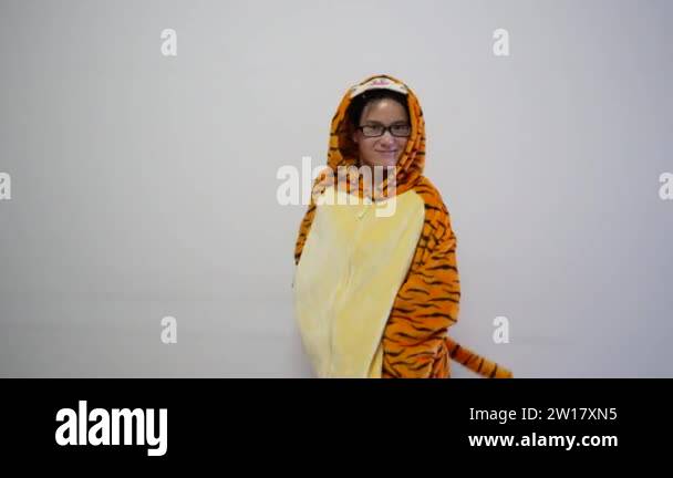 Chinese girl dancing wearing tiger clothe. workers are out of serious ...