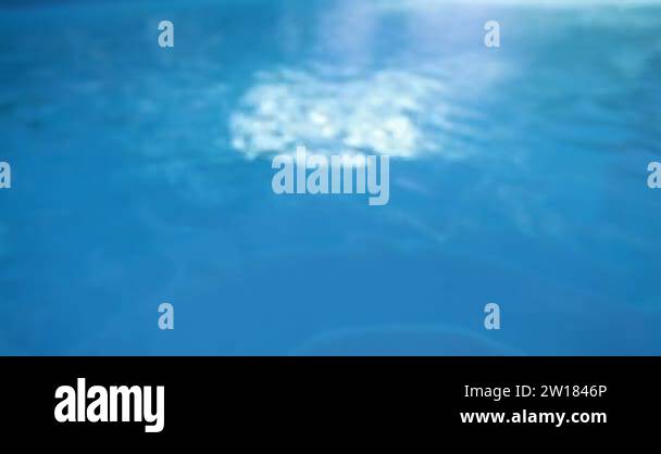 Water surface texture, Slow motion looping clean swimming pool ripples ...