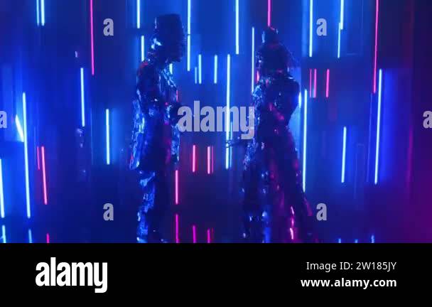 Neon light couple metallic shiny couple dancing together. Modern glass ...
