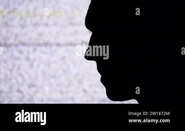Profile Silhouette of a Male Face on a TV Screen with White Noise and ...