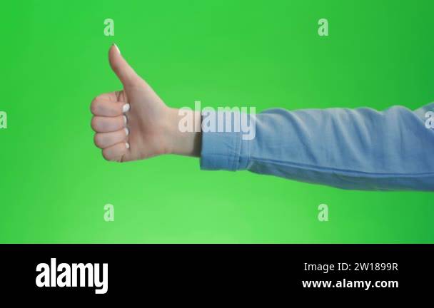 Thumbs up sign hand gesture on green screen. Simbol of approval like ...