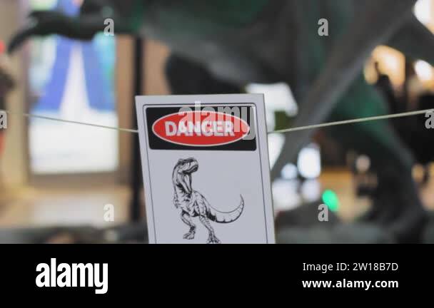 dinosaur sign danger zone symbol caution safety wild Stock Video ...