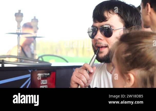 MOSCOW, RUSSIA - JULY 27, 2019: Man smoking hookah on hookah festival ...
