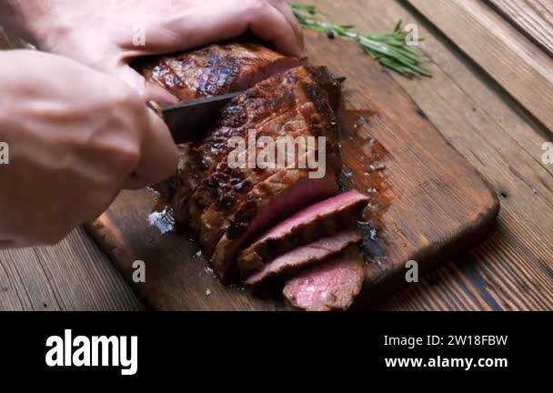 Chef with Vintage Knife Cuts of Grilled Beef Steak on Rustic Cutting ...