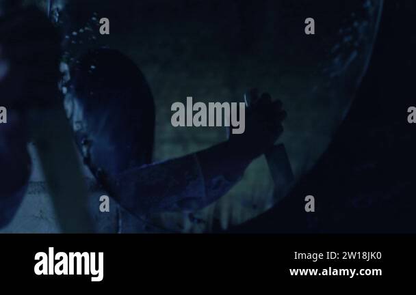 Cruel witch stabbing victim with knife for sacrifice ritual, mirror ...