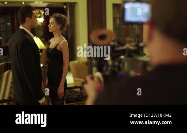 A male actor and female actress plays a role during filming Stock Video ...