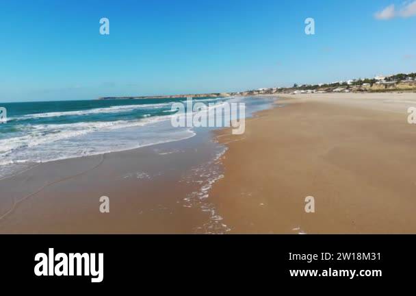 Huge sandy beach, beautiful Atlantic Ocean Coast with light sea waves ...