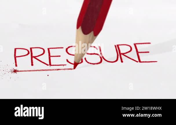 Pressure word written in red is strongly underlined by a pencil that ...