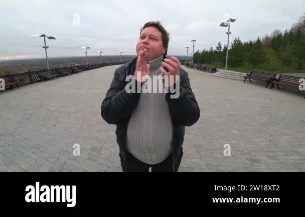 Wide angle lens: young fat man looking at camera and clapping Stock ...