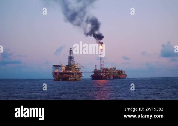 FPSO tanker vessel near Oil Rig platform. Offshore oil and gas industry ...
