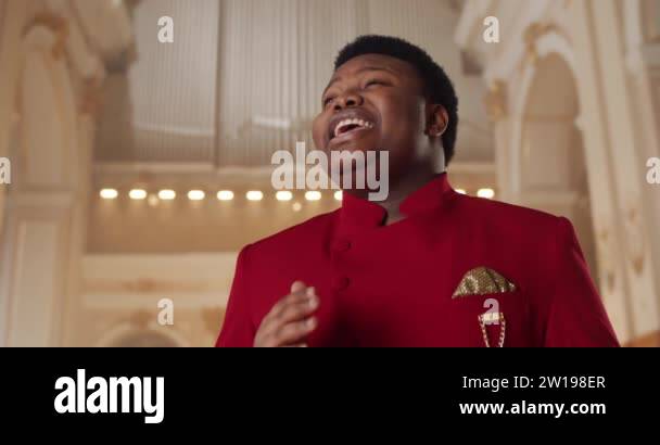 Close up shot of young afro american man singing and moving hands ...