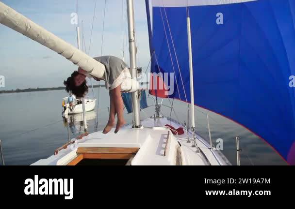 Girl waving feet on boat Stock Video Footage - Alamy