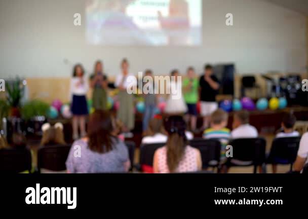 Little children in kindergarten perform on stage in front of their ...