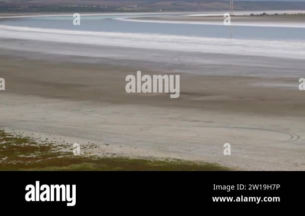 Salt in the upper Kuyalnik estuary, dry mud, cracked silt and salt ...