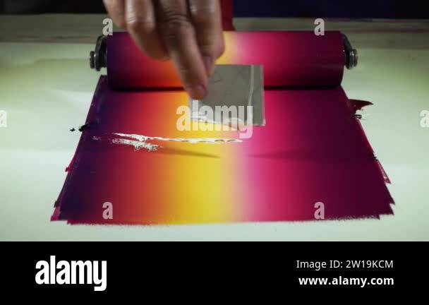 Mixing colors using a roller to rotate colors so that each color is ...