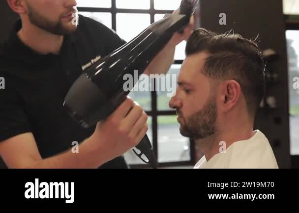 Professional and proper hair care. Cutting hair and beard. Hairdresser ...
