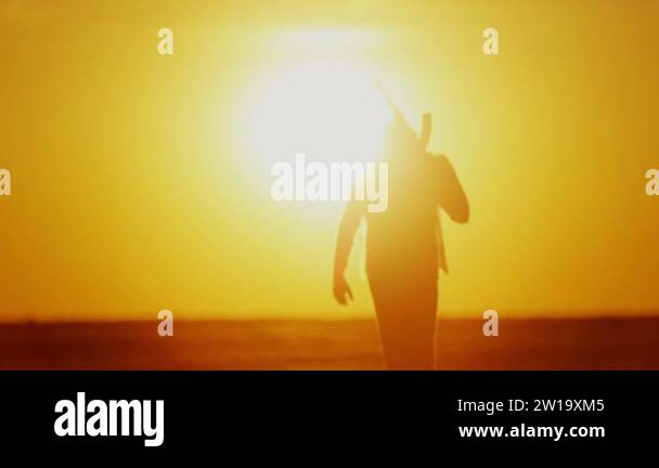 Islamic warrior with Kalashnikov at sunset day. Muslim fighter is ...