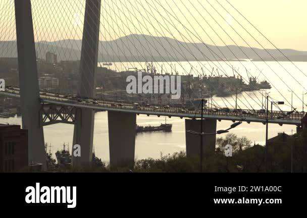 Cable-stayed road bridge stands over the strait on which the ship is ...