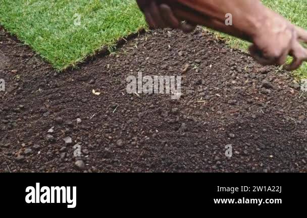 Gardener Grading Out Soil With A Rake. SLOW MOTION. Unrecognizable ...