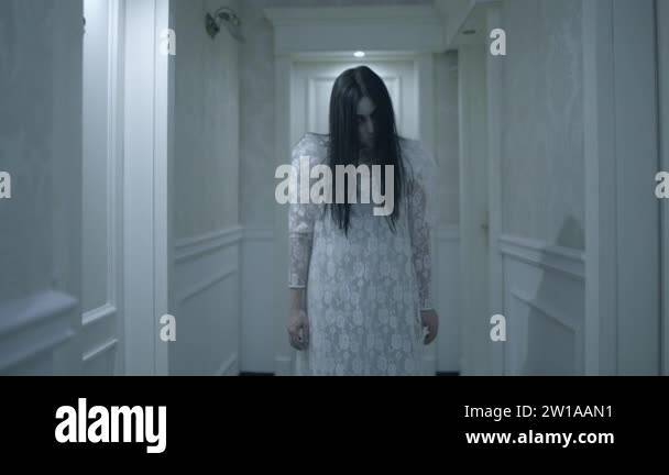 Possessed woman making horrifying head moves, staring at cam with crazy ...