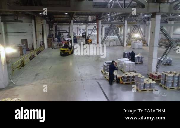 Workflow in a warehouse, active work in a warehouse, forklifts in a ...