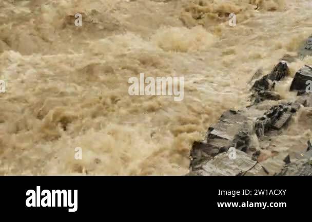 Natural disasters and extreme weather. Raging river with dirty water ...