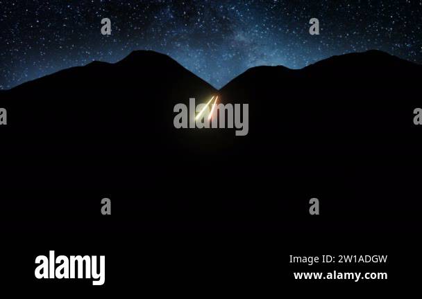 Cars headlights traces time-lapse against mountains landscape starry ...