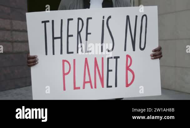 Crop view of male hands holding banner with there is no planet b ...
