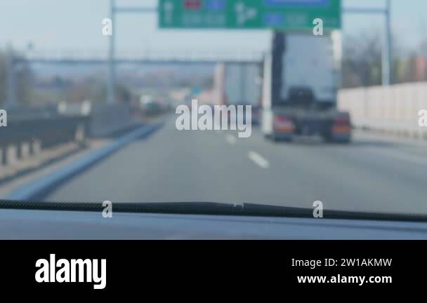Car passing and bend to the right to exit ramp of highway in Europe ...