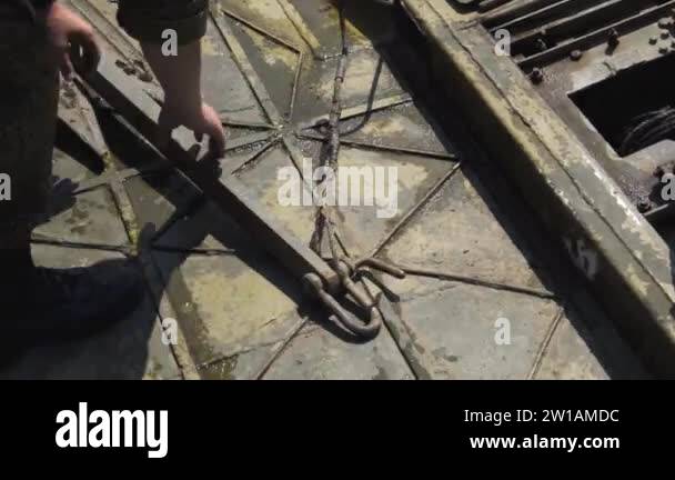 A military cadet soldier works on a pontoon with an internal ...