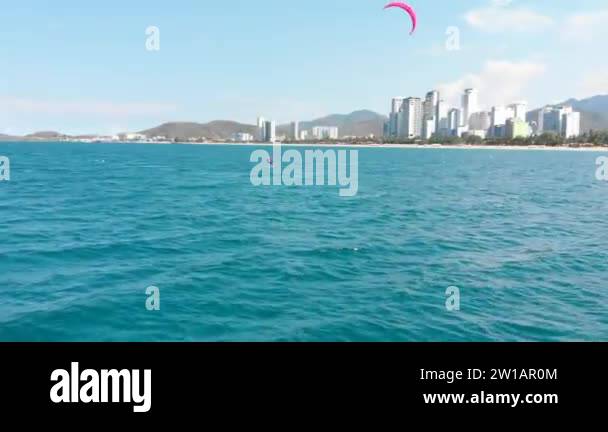 Jump acrobatic of professional kite surfer on the sea wave, athlete ...