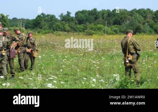 MOSCOW - JULY 30. Soldiers shoot from an AK-47 machine gun at targets ...