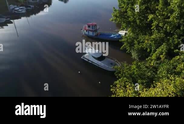 Aerial drone scene showing tranquil river delta with fisherboat and ...