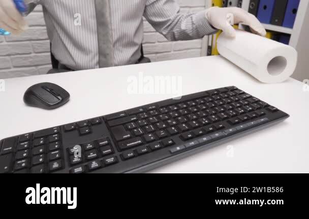 concept of cleaning or disinfecting the office desk - a businessman ...