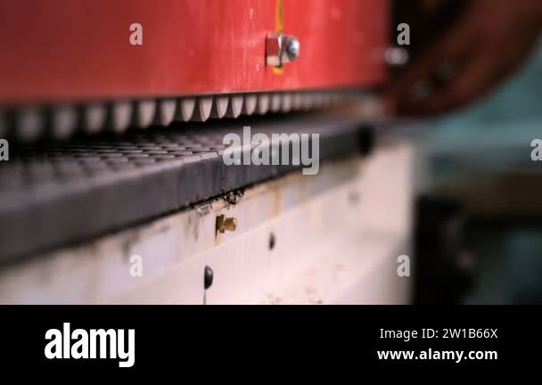 Edging of furniture parts in a woodworking workshop. Machine for gluing ...