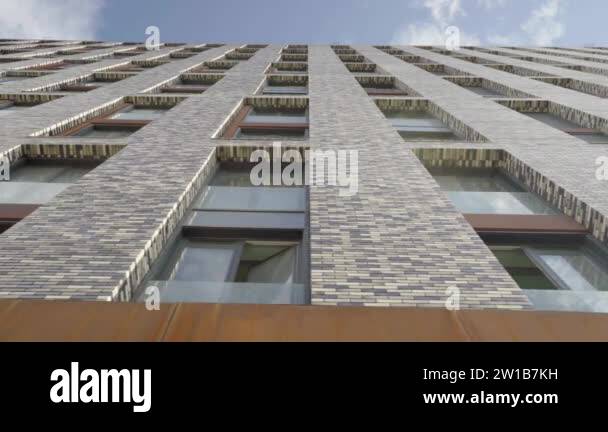 the facade of brick high-rise apartment buildings with stained glass ...