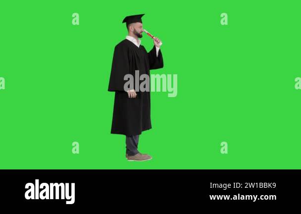 Happy student wearing the graduation robe and holding his certificate ...