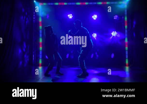 Silhouettes of a talented young girl and boy hip hop dancers. Hip hop ...