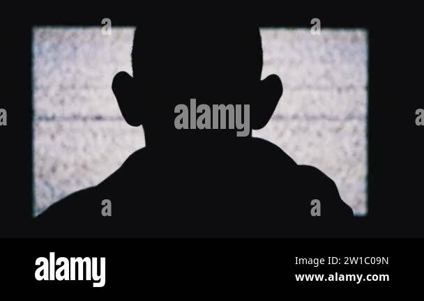 Silhouette of an Anonymous Mans Head is Watching White Static Noise and ...