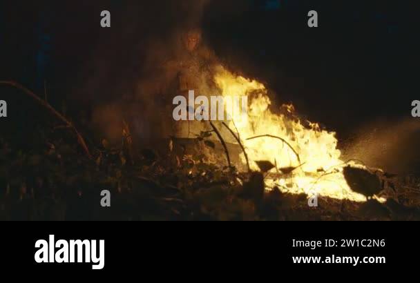 firefighter hero in action danger jumping over fire flame to rescue and ...