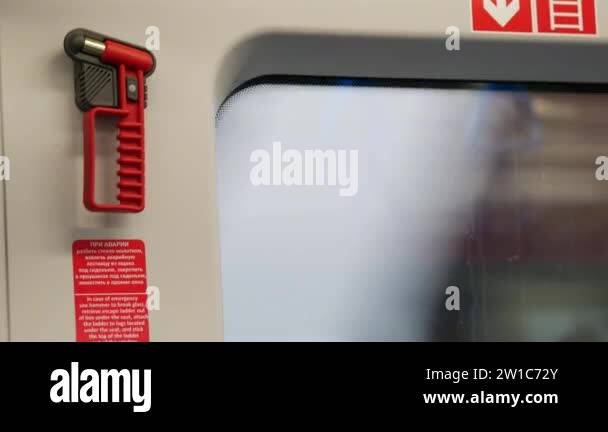 Emergency exit window in the wagons of the Moscow Central Ring MCC. Red ...