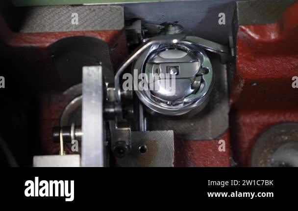 Here is a close up of a sewing machine bobbin. shuttle for sewing ...