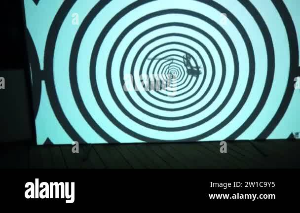 Psychedelic animation on a huge monitor in a dark room Stock Video ...