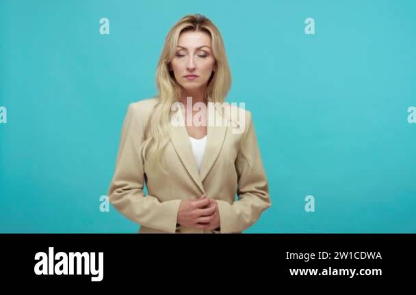 Be careful. Strict and serious blond woman in business suit warning ...