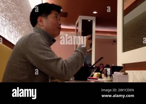 Man eating inside Stock Videos & Footage - HD and 4K Video Clips - Alamy