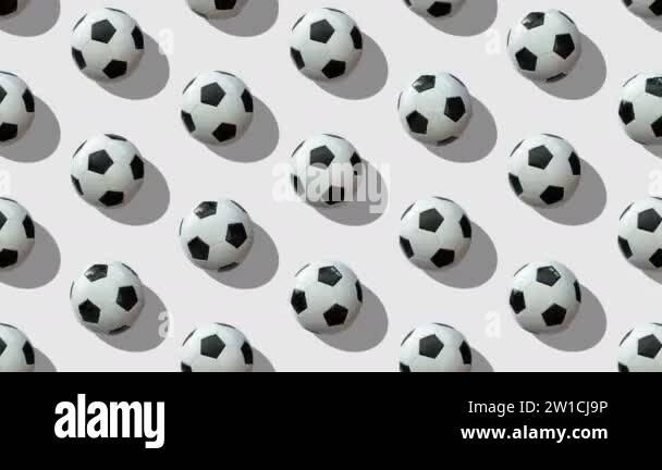 Animated background from large group of soccer balls. Balls roll ...
