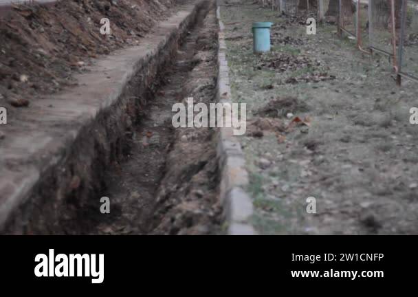replacement of pipes on the street trench. open ground asphalt. repair ...