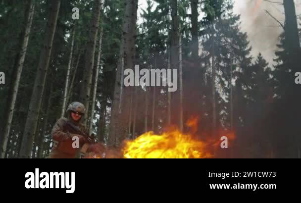 firefighter hero in action danger jumping over fire flame to rescue and ...